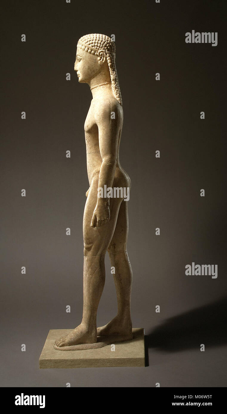 This marble statue of a kouros represents a youthful male figure, typical of Greek sculpture ...