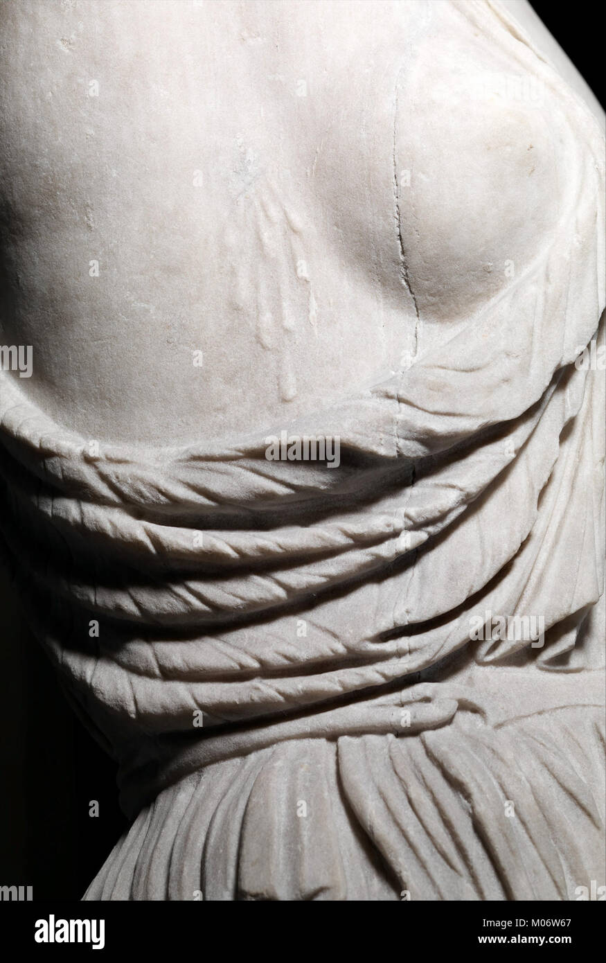 This marble statue depicts a wounded Amazon, exemplifying classical ...
