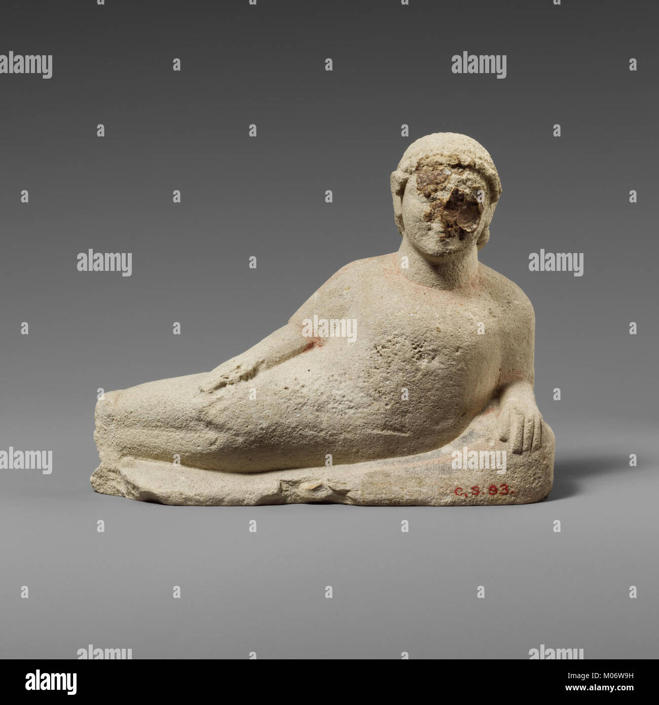 This limestone sculpture shows a male figure at a banquet, illustrating ...