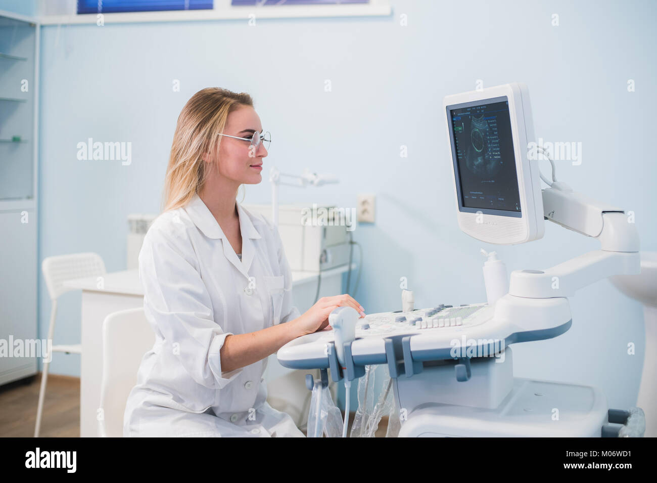 Ultrasound machine, doctor's hand usg investigation USCG Stock Photo ...