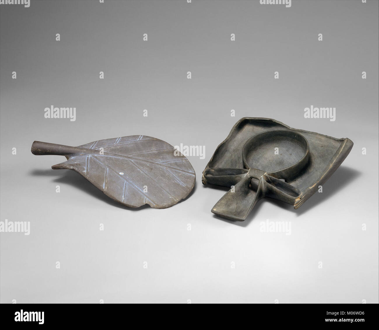 This libation dish features a depiction of Ka-Arms presenting an Ankh ...