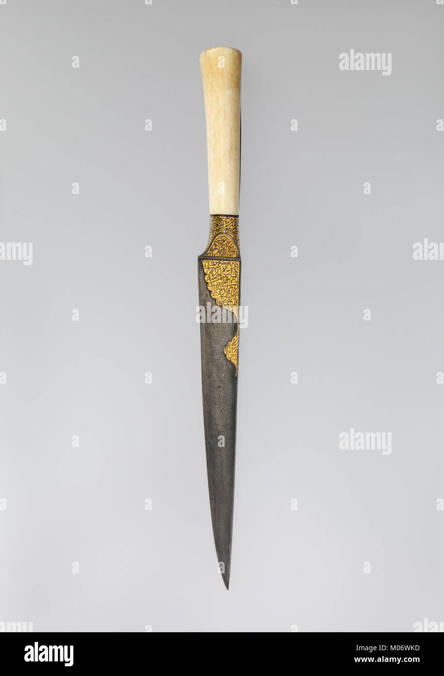 This knife features an ivory handle with Qur'anic inscriptions ...
