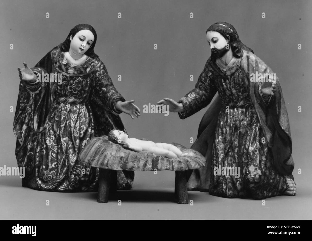 This artwork depicts the figure of Mary from a nativity scene ...