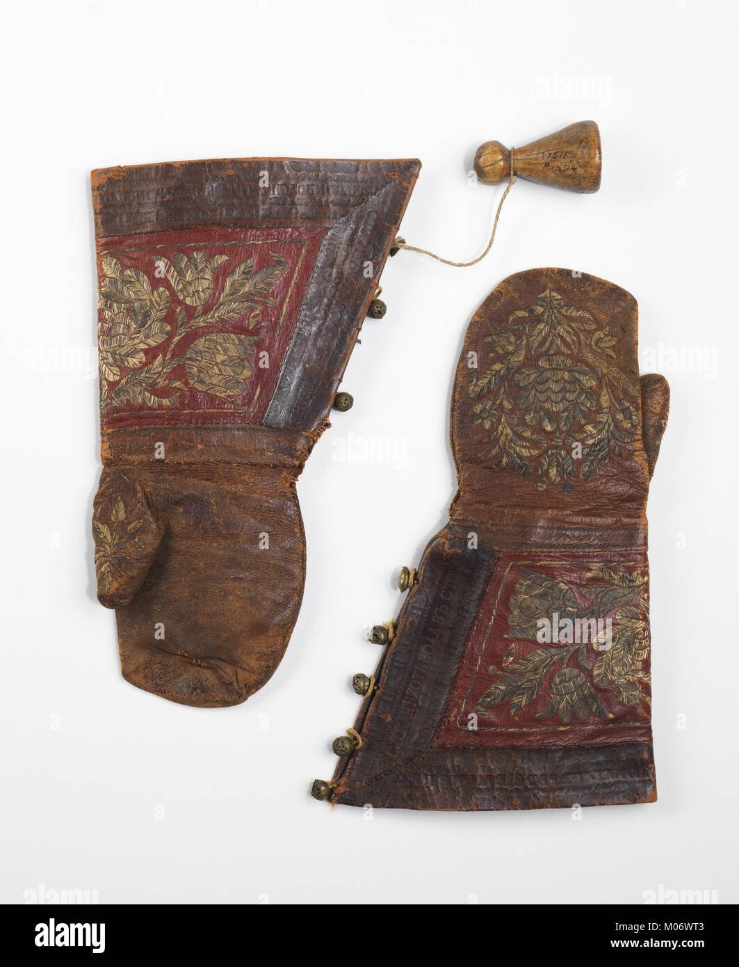 These hand-woven mittens from the 19th century display intricate ...