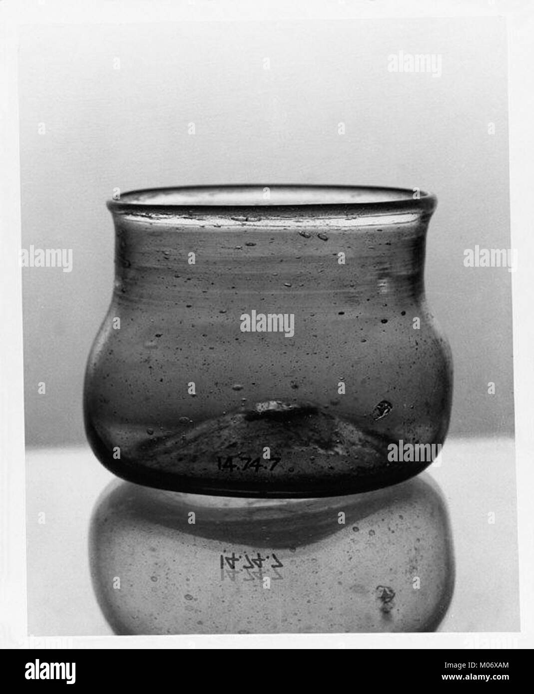 The jar, made of ceramic or glass, illustrates period design trends and ...