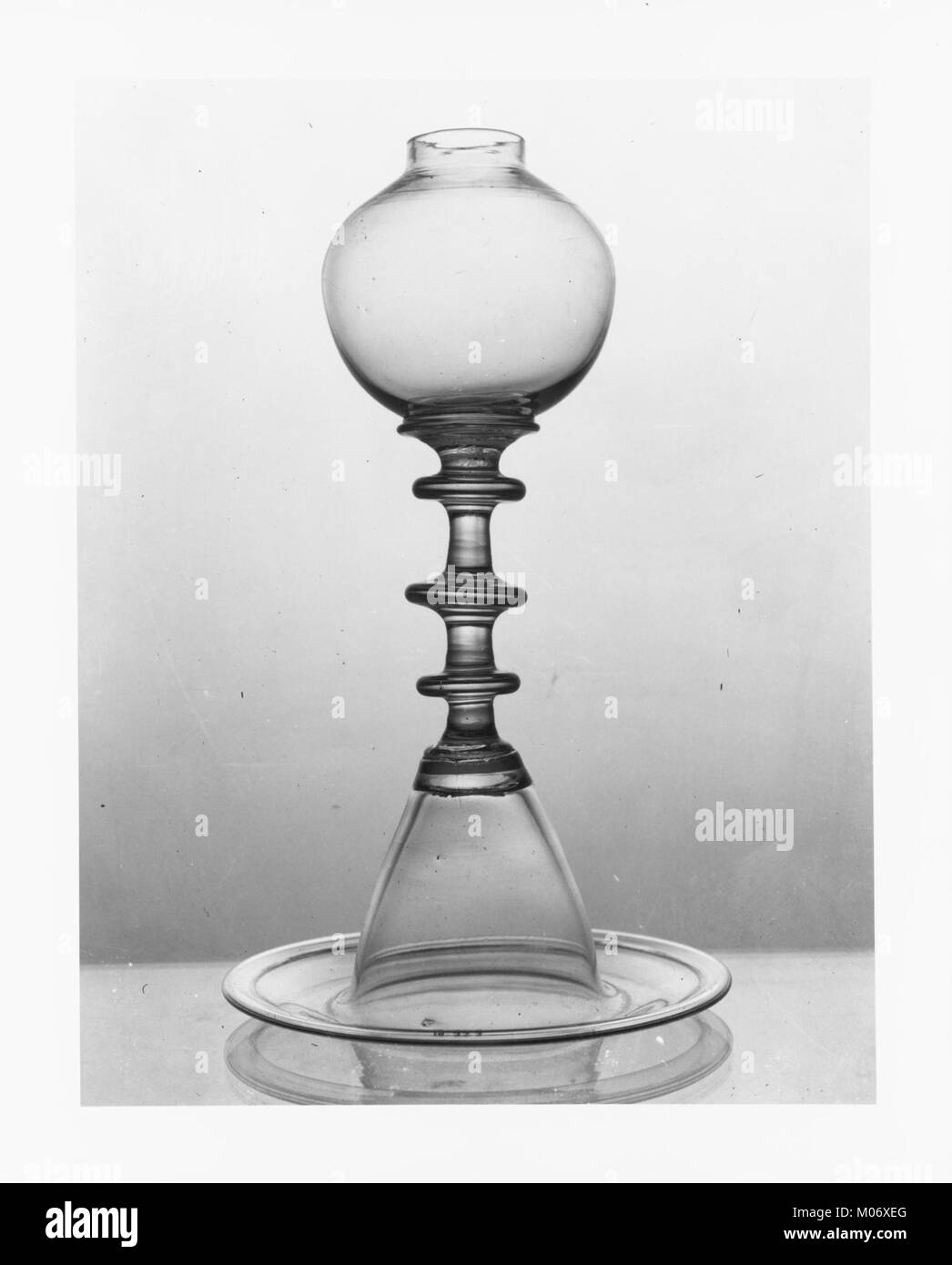 This historical lamp reflects the design and function of lighting in ...