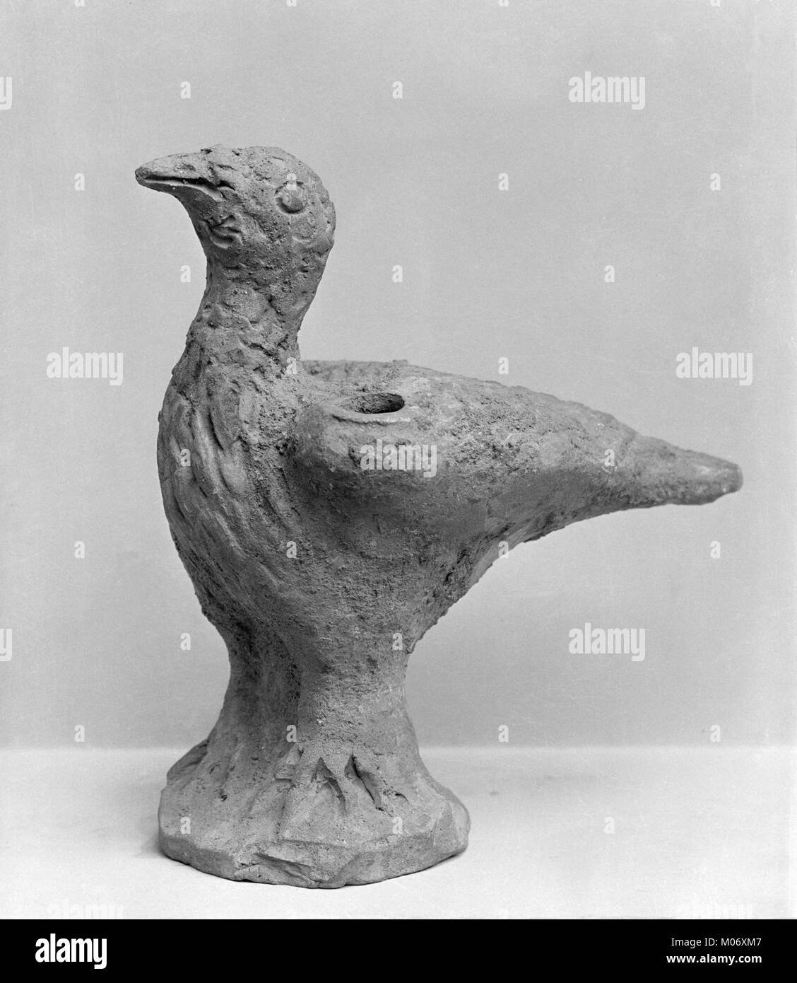 This historical lamp showcases ancient lighting technology. Its design ...