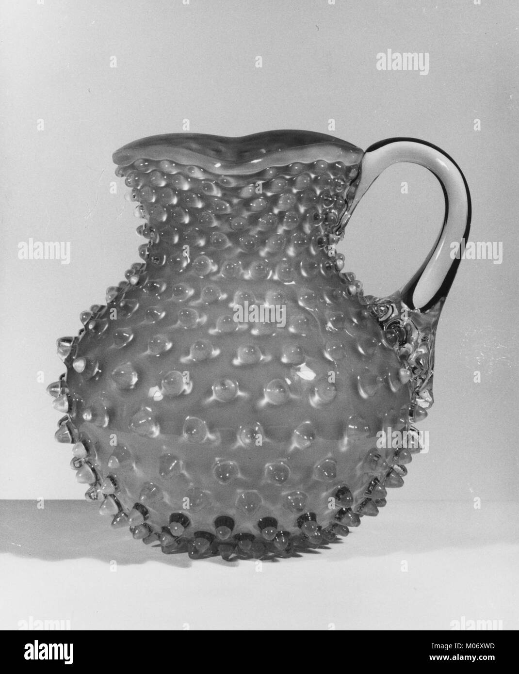 This hobnail pitcher, made with distinctive textured patterns ...