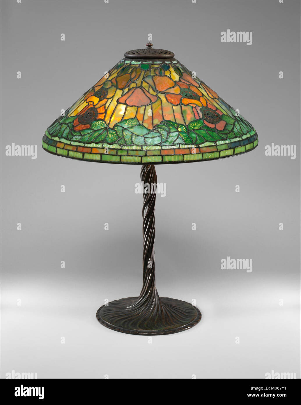 This lamp features intricate design elements, showcasing both ...