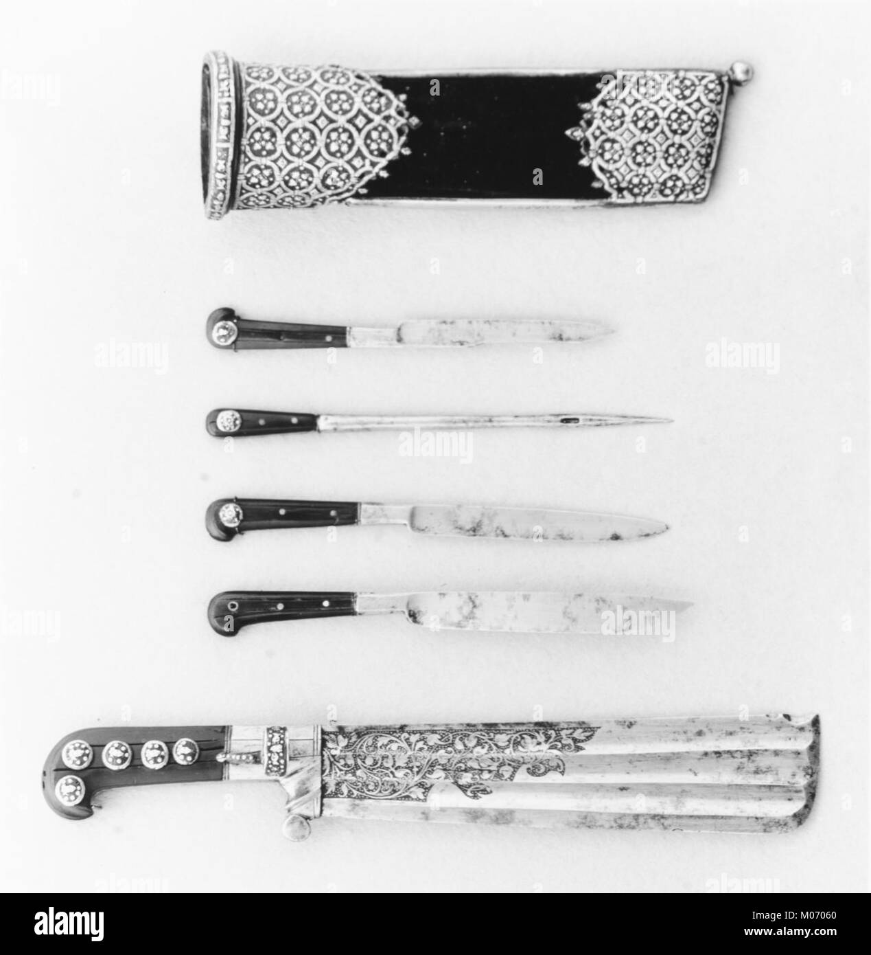 This hunting knife set, including implements (trousse), illustrates ...