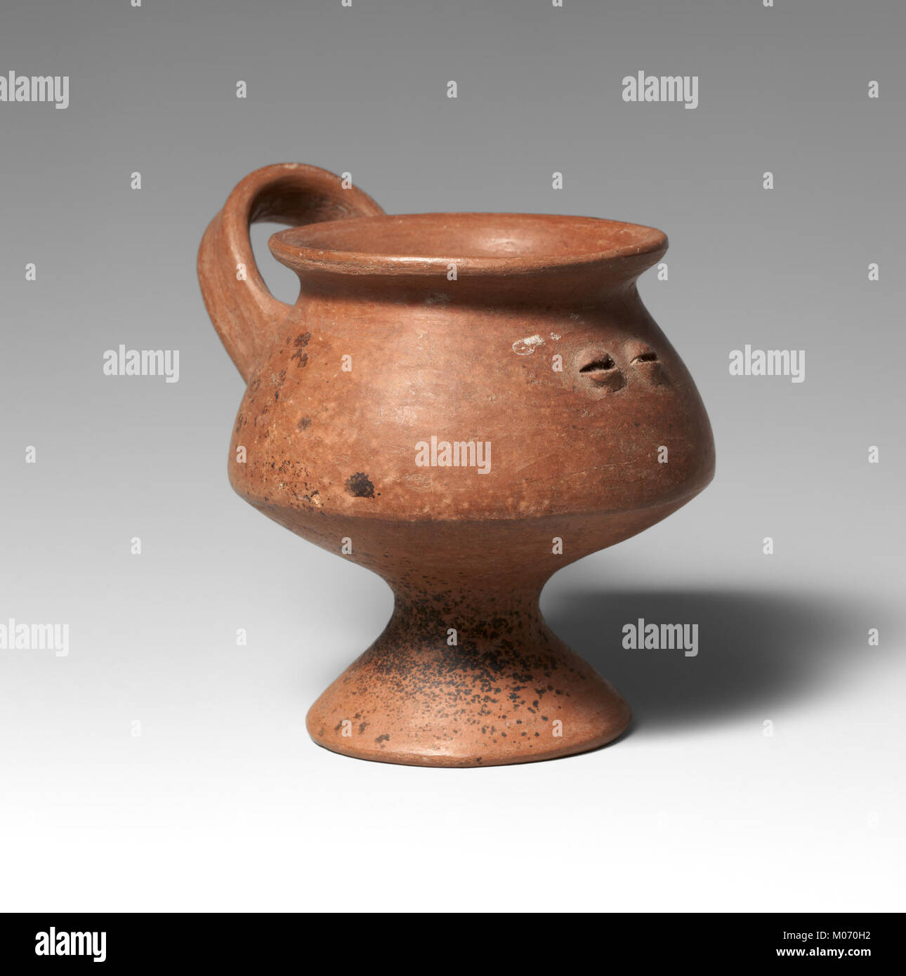 This miniature vessel, made of ceramic, represents the delicate ...
