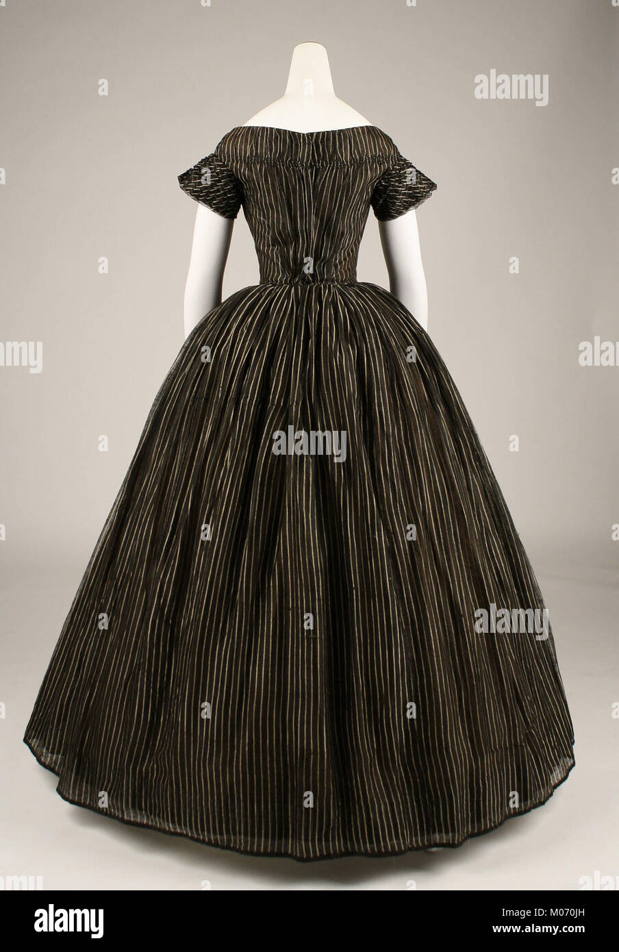 This 19th-century mourning dress reflects Victorian fashion and the ...