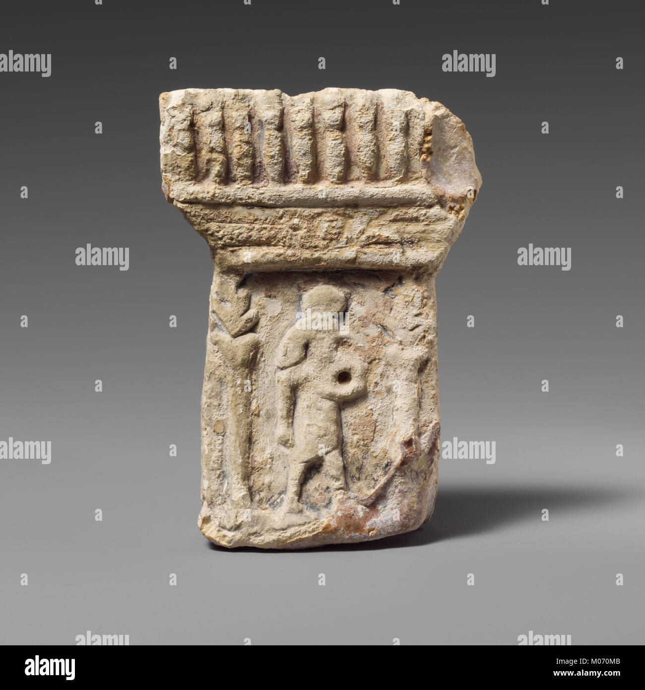 This limestone naiskos, featuring Egyptianizing decoration, is an ...