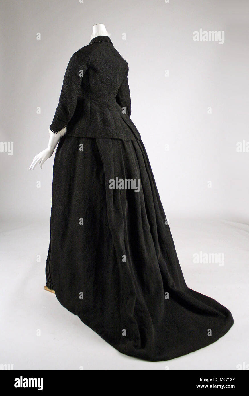 This mourning dress from the 19th century features somber colors and a ...
