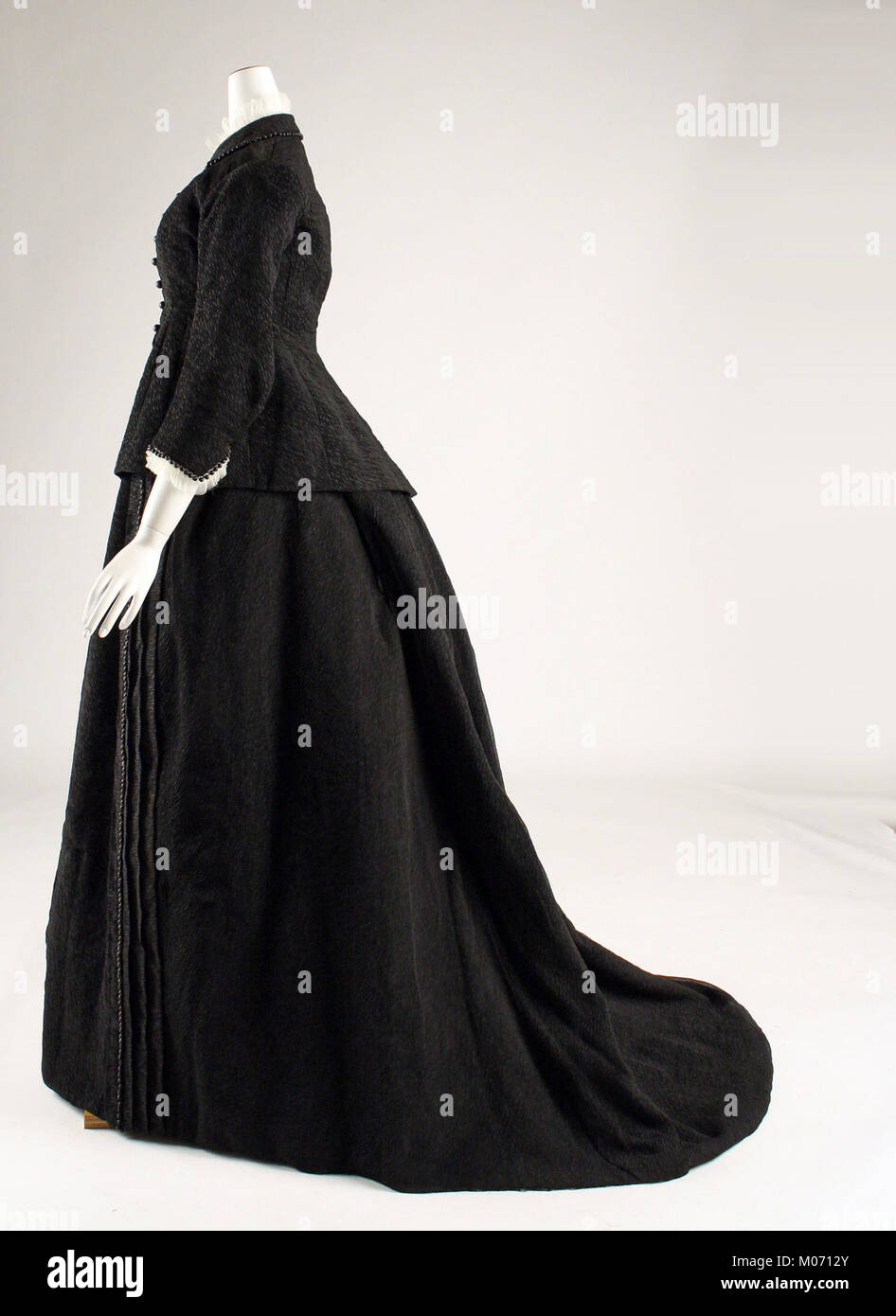 This mourning dress is a historical garment, reflecting the cultural ...