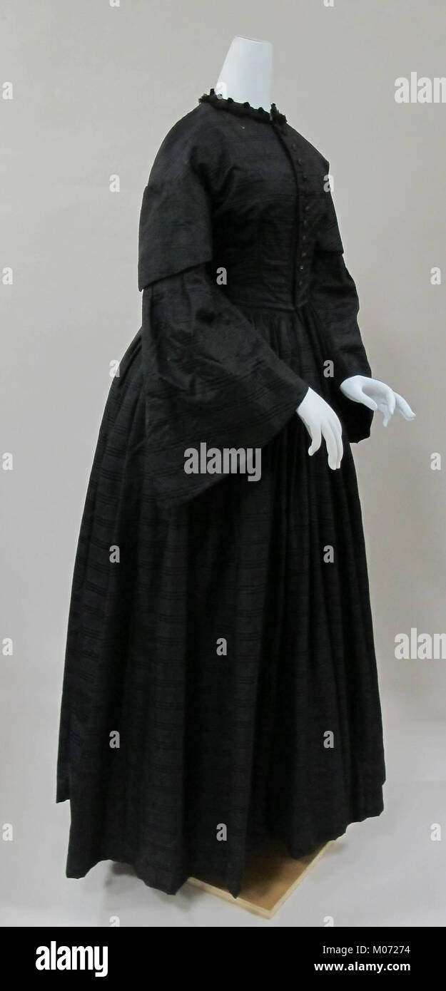 This mourning dress, designed in the late 19th century, represents ...