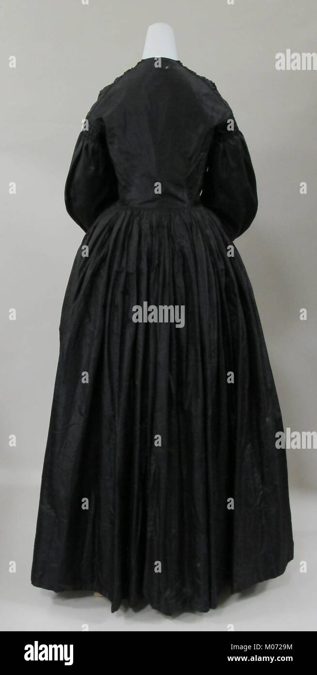 This mourning dress, from the 19th century, exemplifies Victorian ...