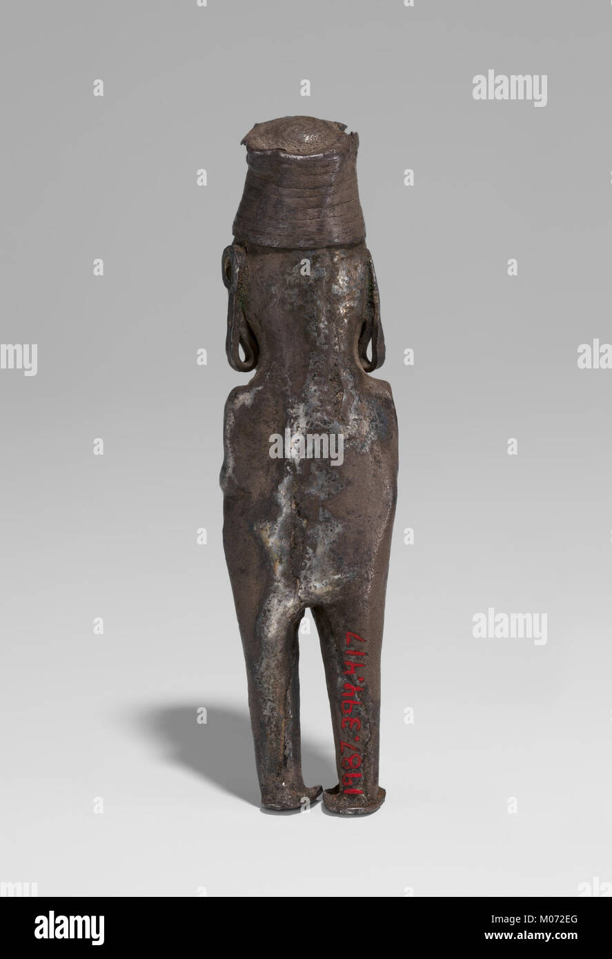 This male figurine is a small sculpture representing a human figure ...