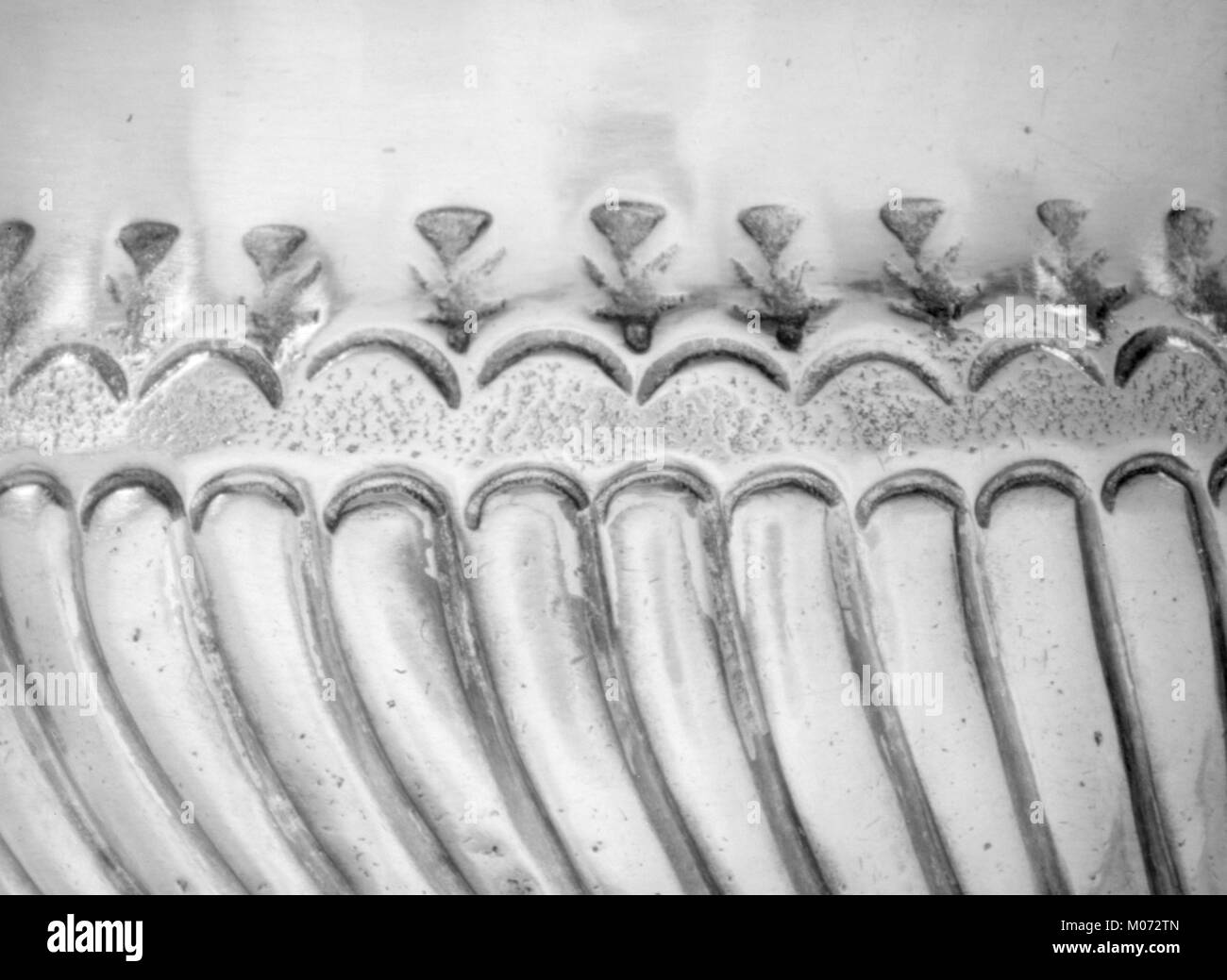 This miniature cup, crafted from fine materials, is a small yet ...