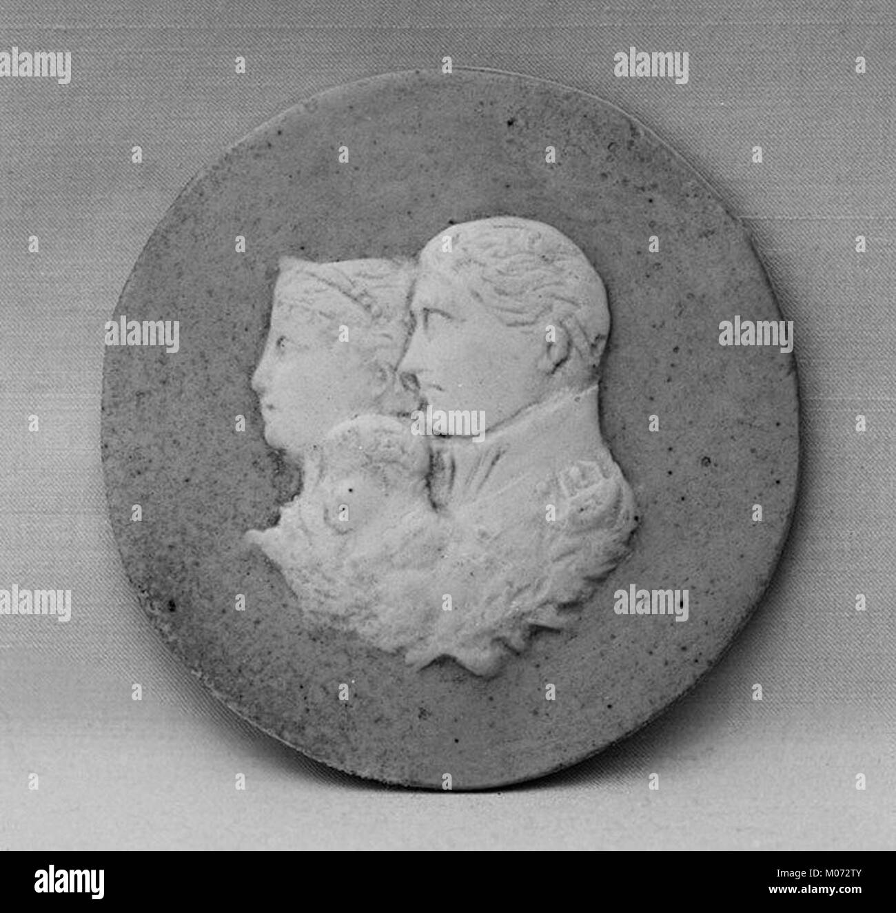 This medallion features intricate decorative designs in metal or stone ...
