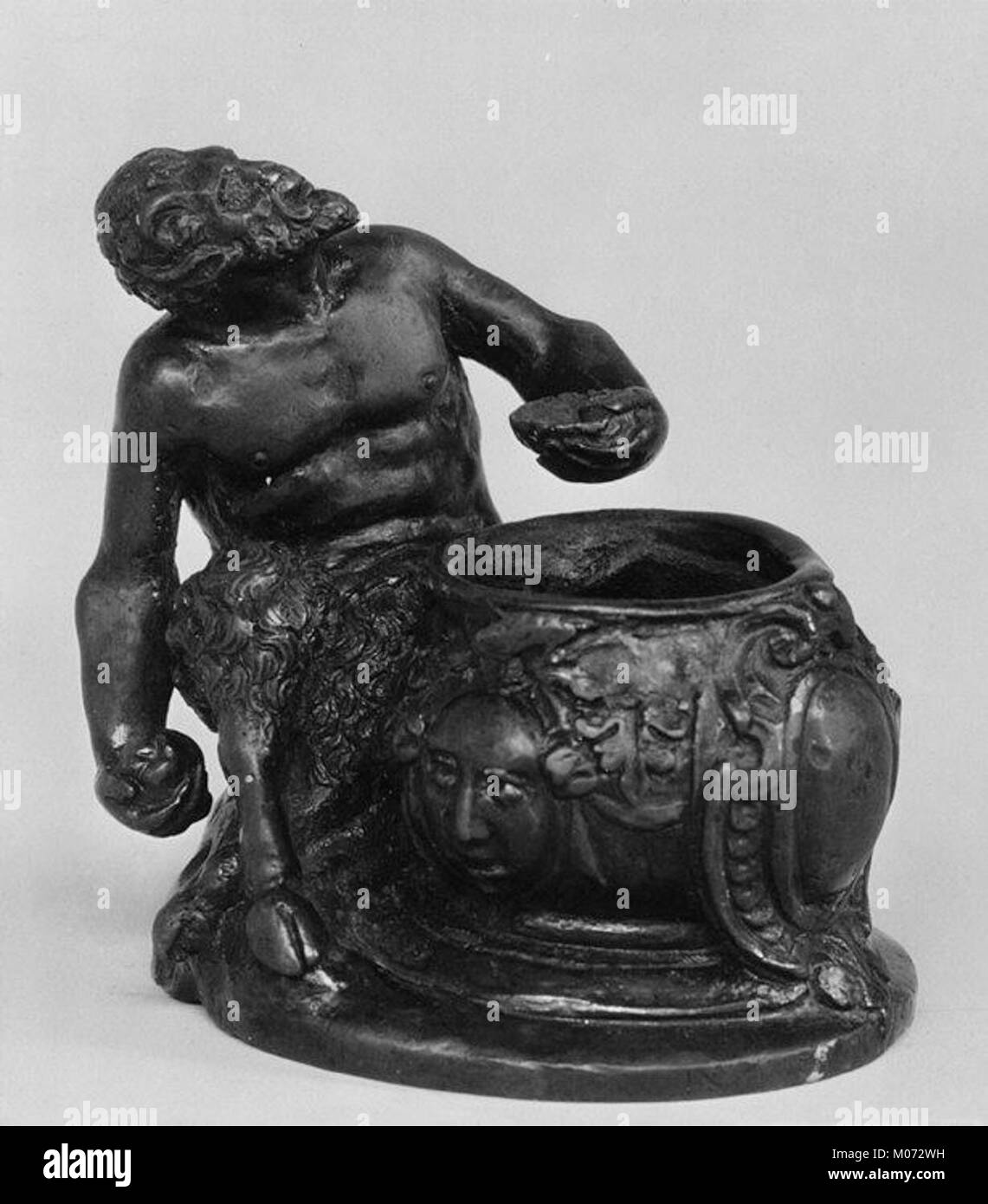 This inkwell is a finely crafted object used for holding ink ...