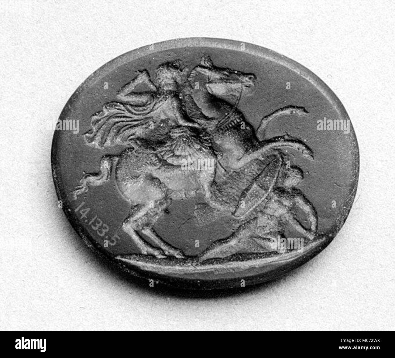 An intaglio gemstone from The MET with detailed engraving, showcasing ...