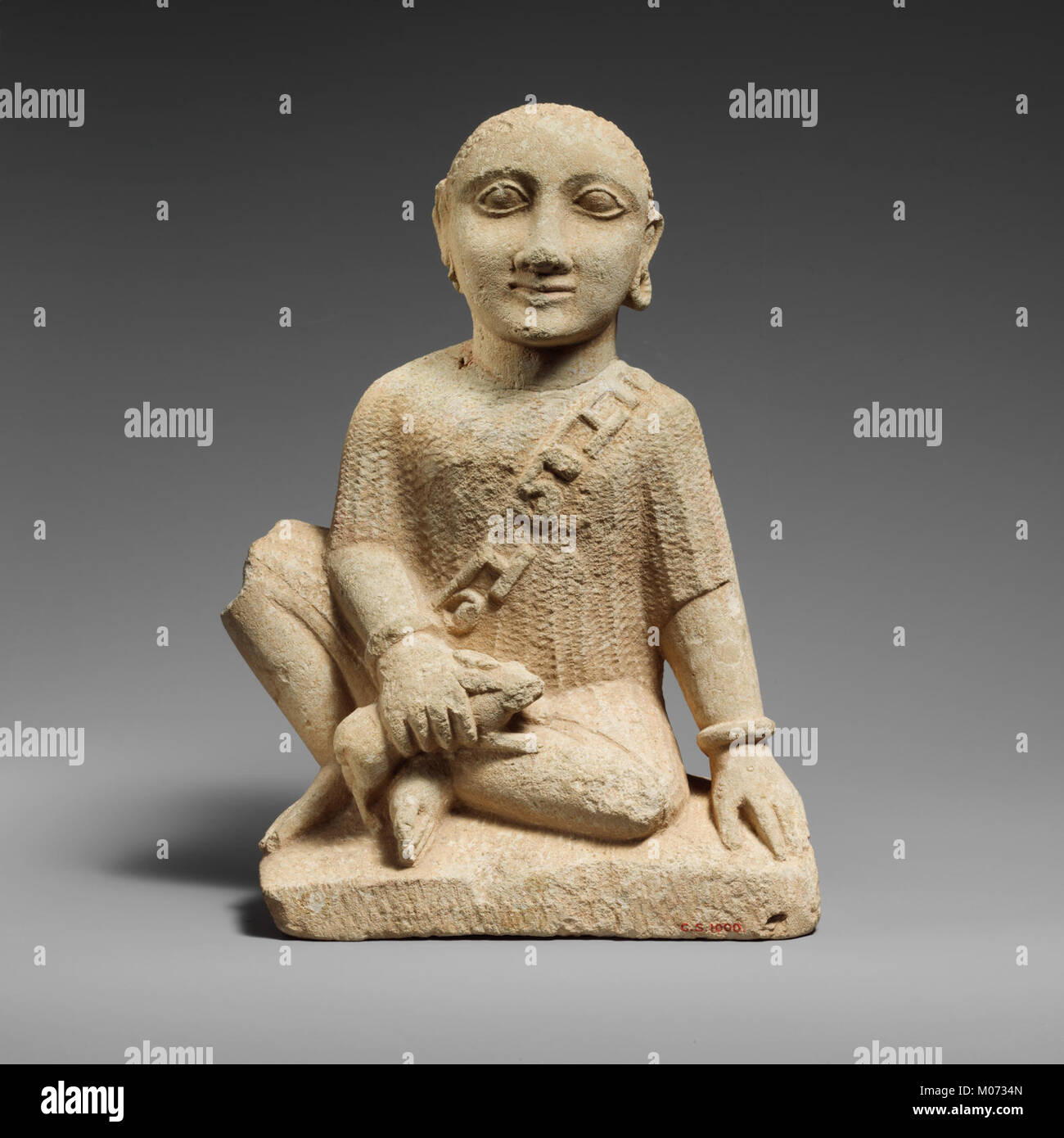 A limestone statuette of a temple boy, preserved in The Metropolitan ...