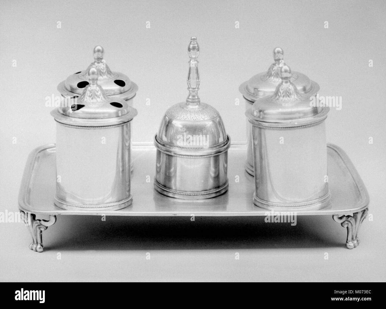 An inkstand, a functional desk accessory designed to hold ink and ...