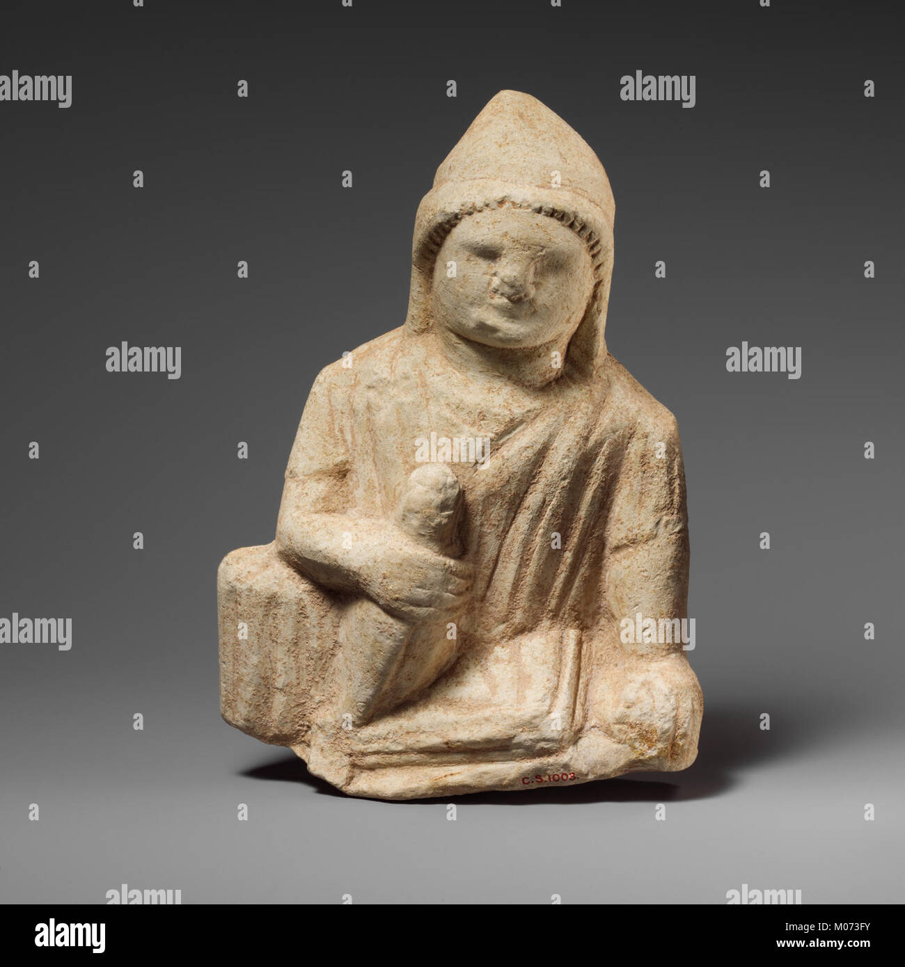 This limestone statuette depicts a temple boy, representing the ...