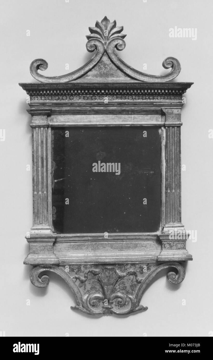 This mirror is a fine example of period craftsmanship, featuring a ...