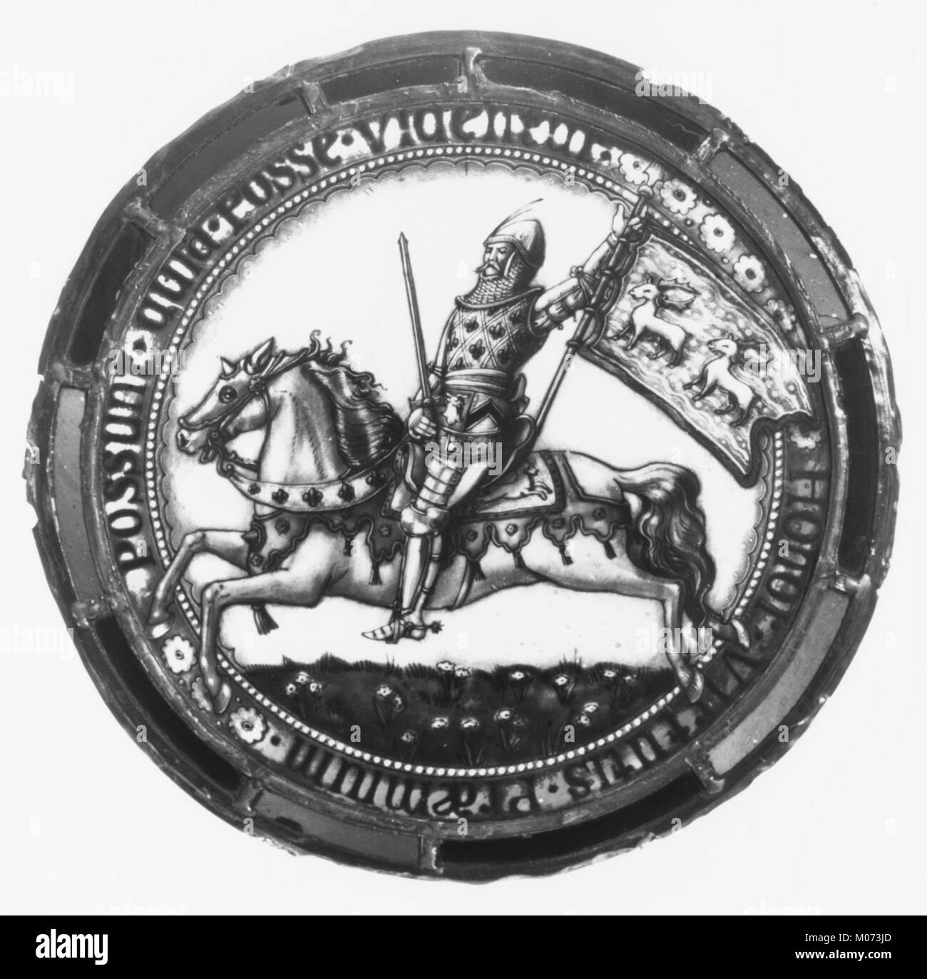 This medallion, crafted from metal, features intricate designs and ...