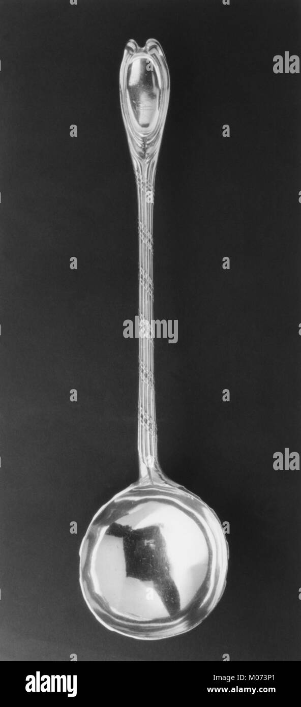 This ladle, made from metal, features a functional and ornamental ...