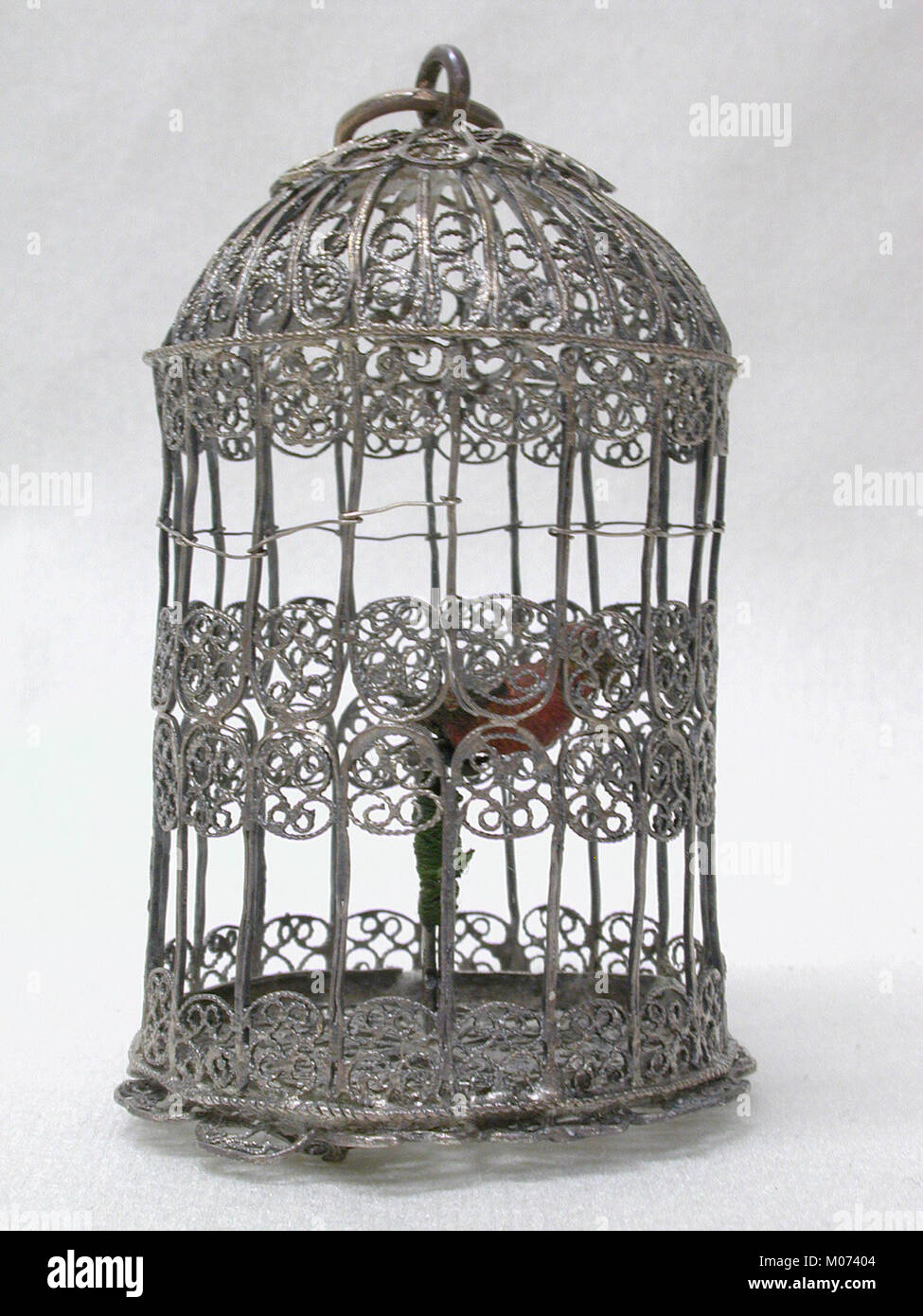 This miniature bird cage, part of a larger set, exemplifies the ...