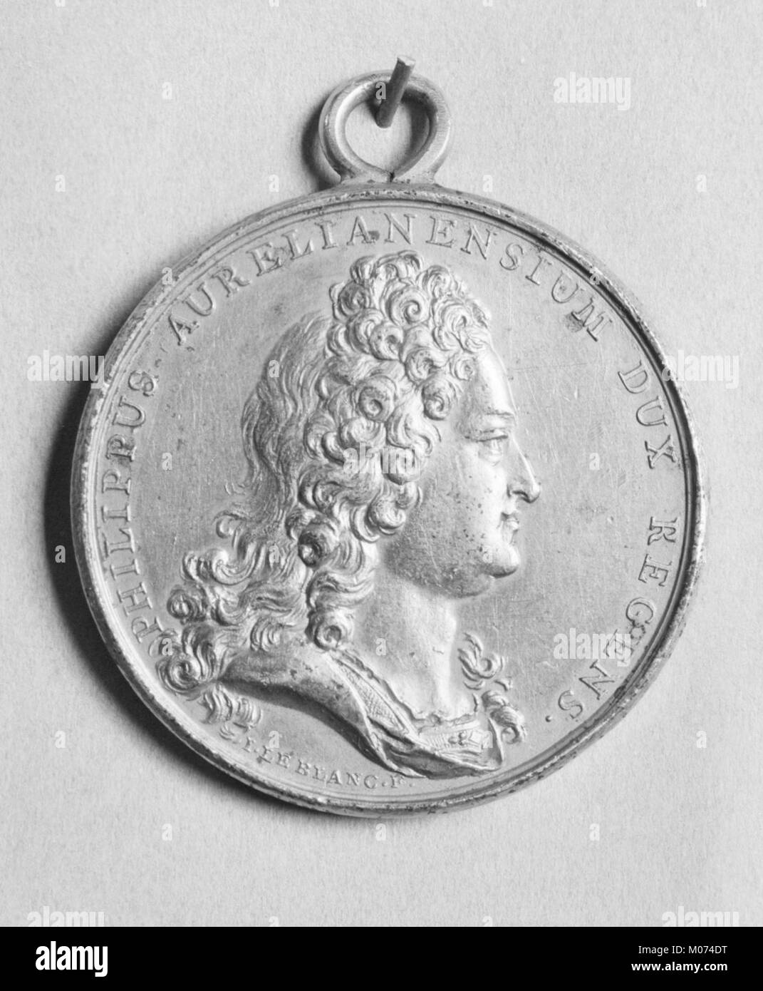 This portrait of King Louis XV portrays the monarch in regal attire ...