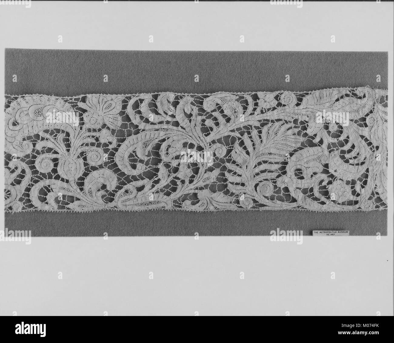 This lappet is a decorative textile element from historical fashion ...