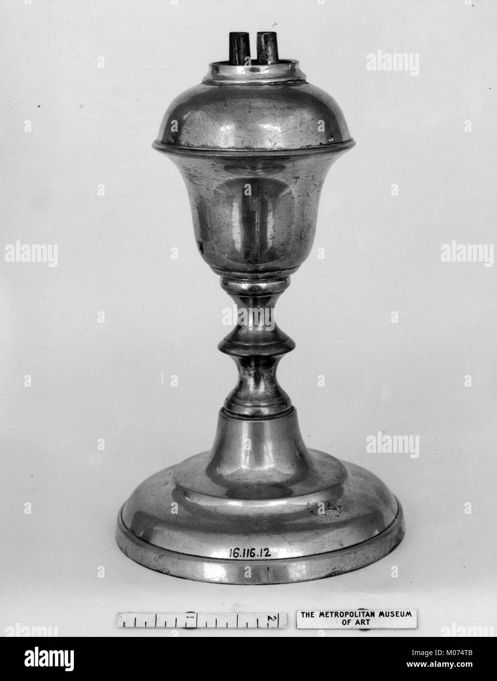 The lamp demonstrates ancient lighting technology, reflecting early ...