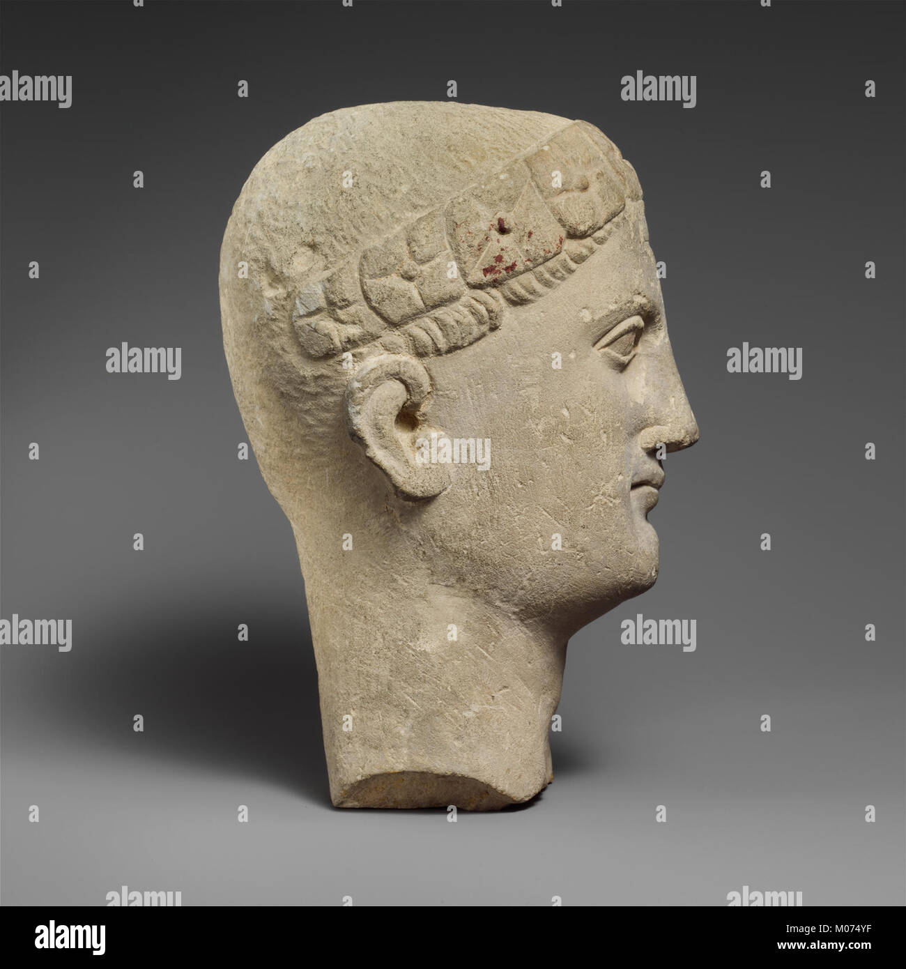 This limestone male head sculpture exemplifies the craftsmanship of the ...