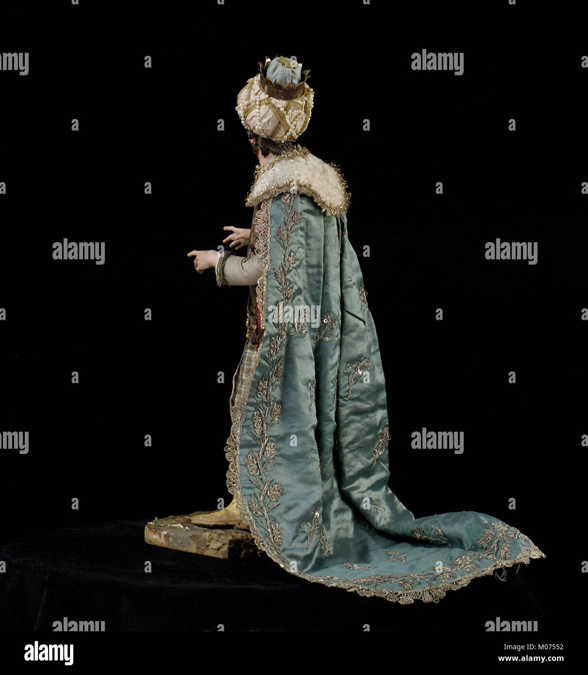 This representation of a king captures the regal attire and symbolism ...