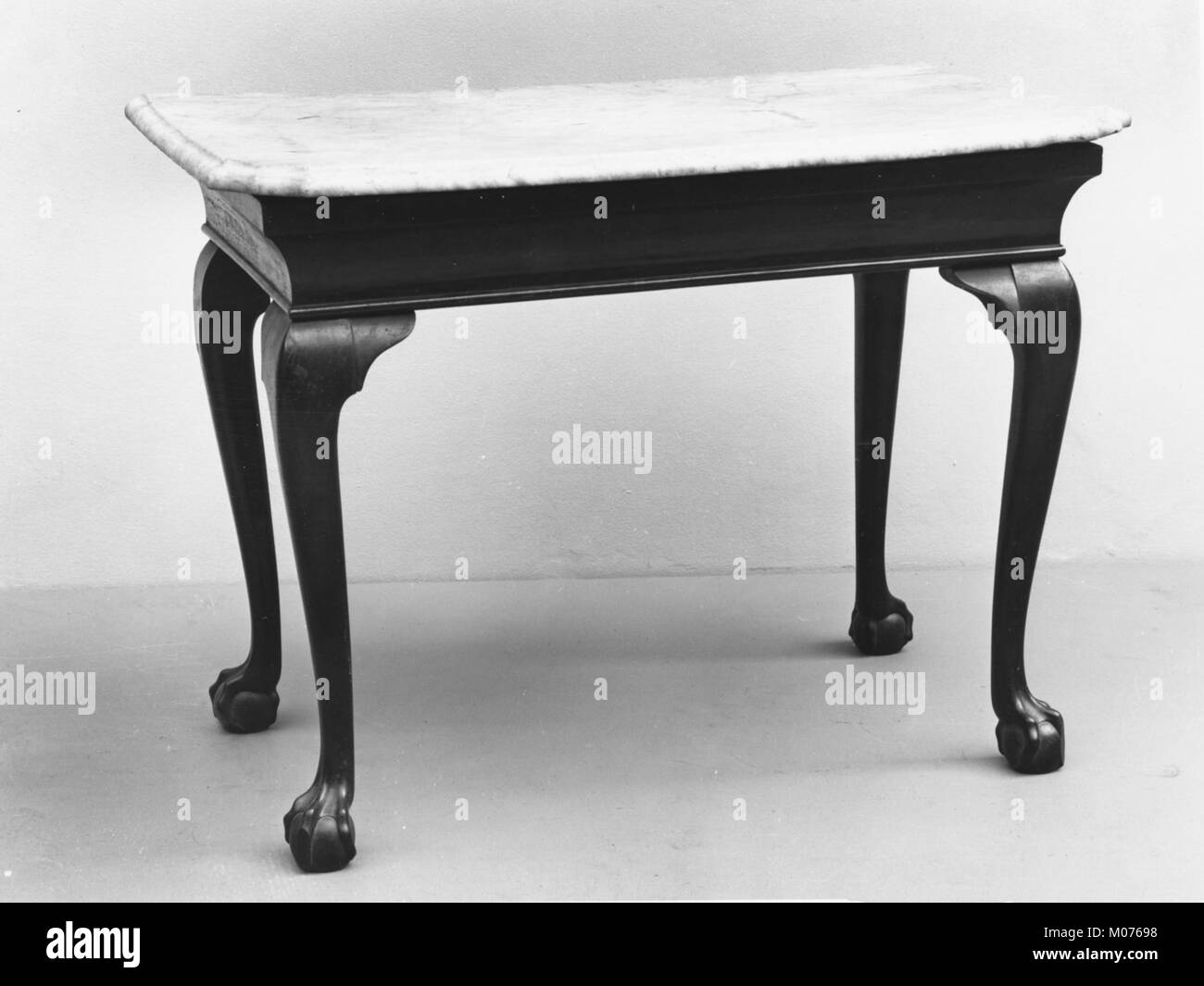 A marble-slab table from the historical period, featuring intricate ...