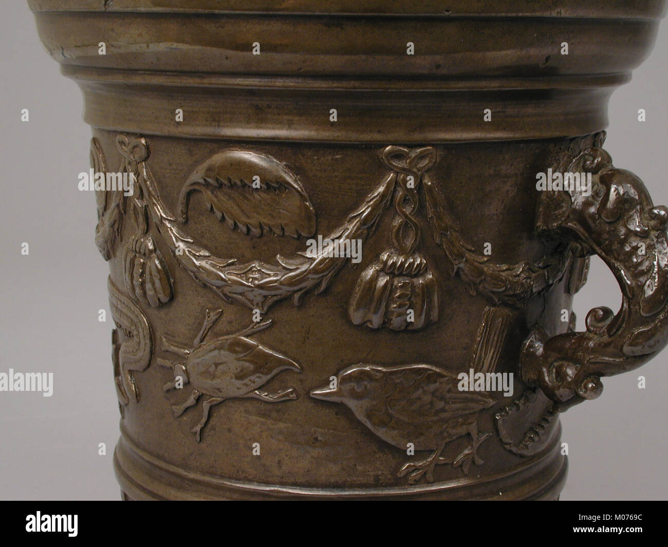 This mortar, featuring an animal frieze, displays detailed carvings of ...