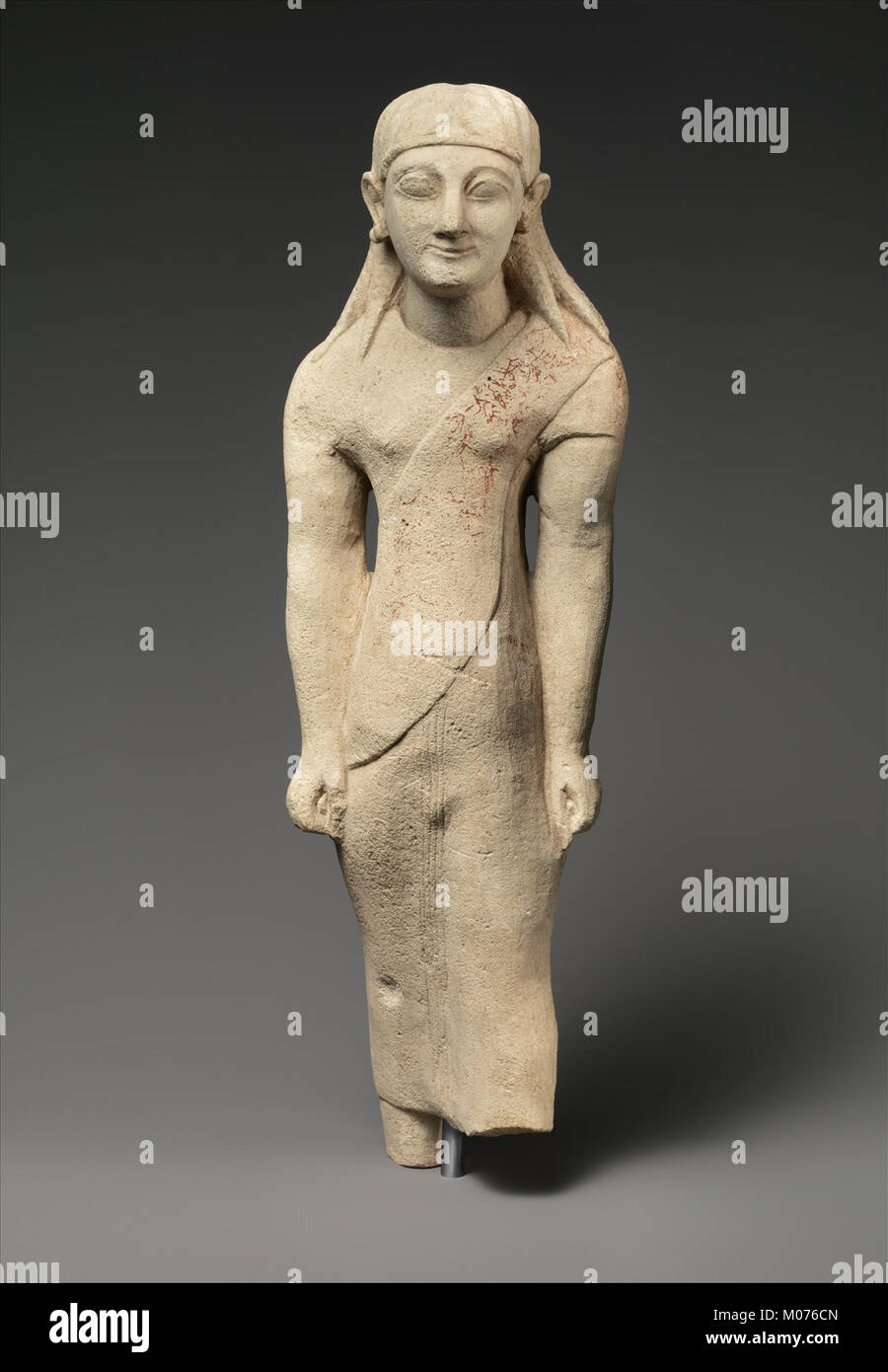 This limestone sculpture depicts a youthful figure, showcasing the ...