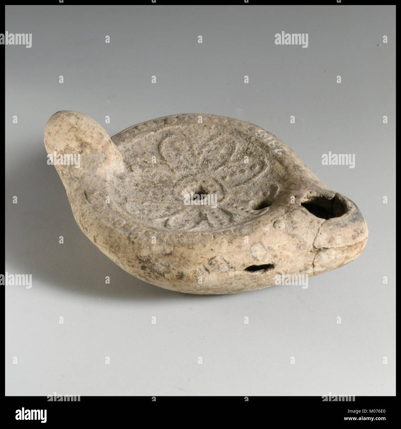 This historical lamp demonstrates period lighting design, materials ...