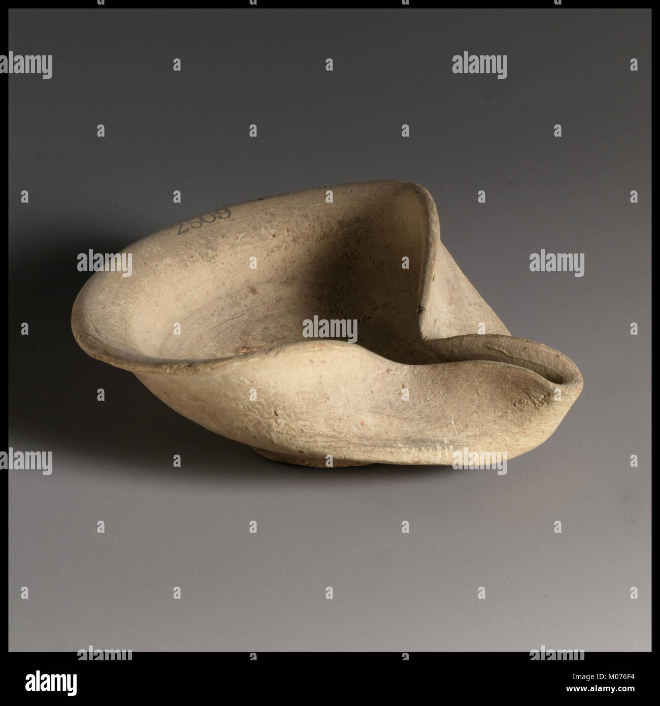 This saucer-shaped lamp was used in ancient cultures for illumination ...