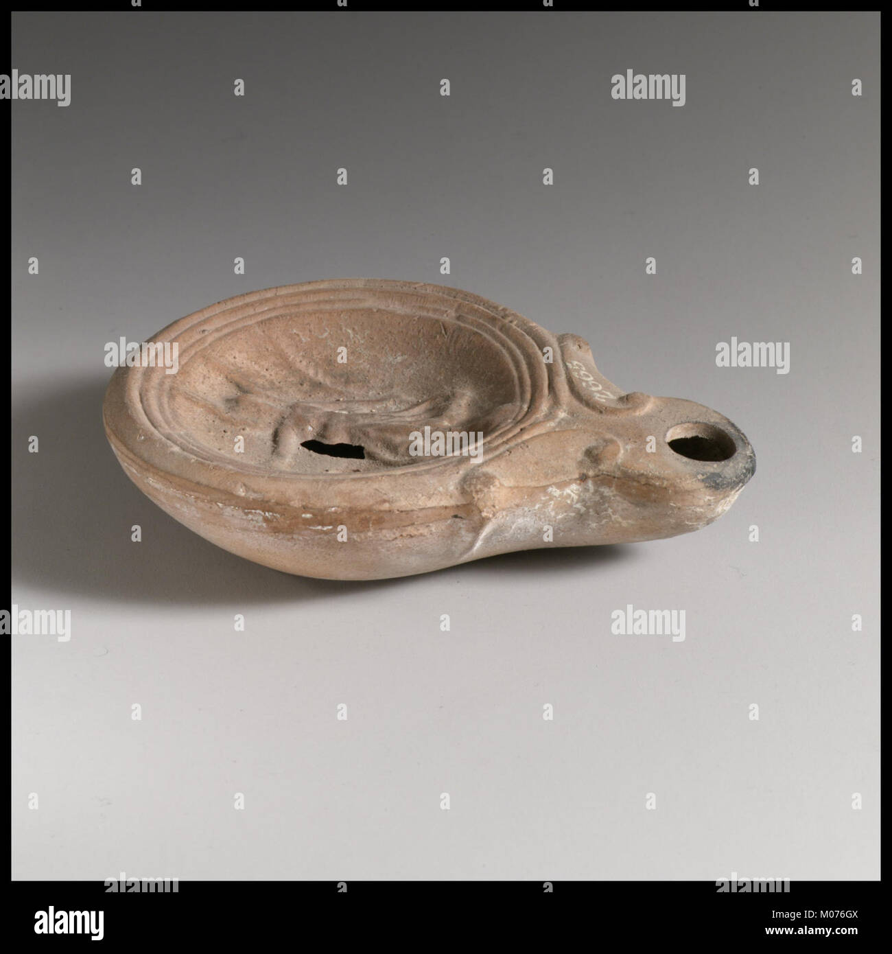 This lamp is a historical artifact featuring detailed craftsmanship ...