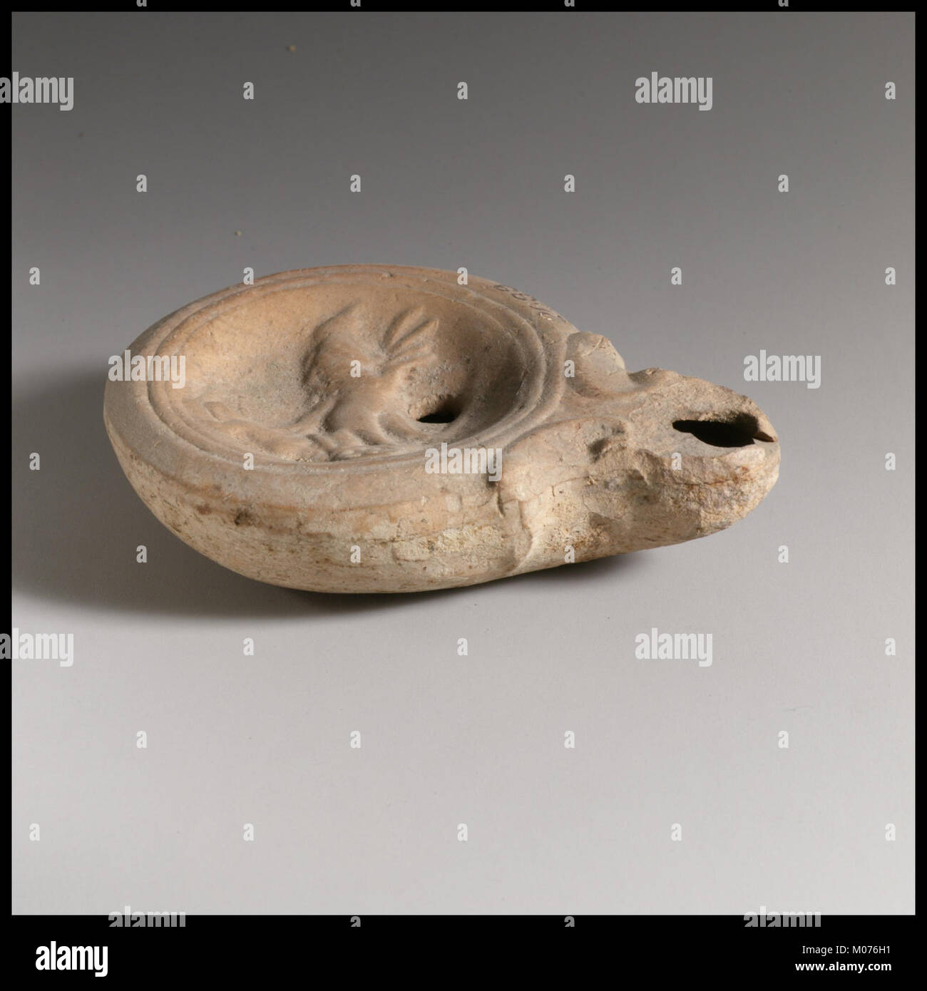This lamp is a historical lighting object, showcasing the design and ...