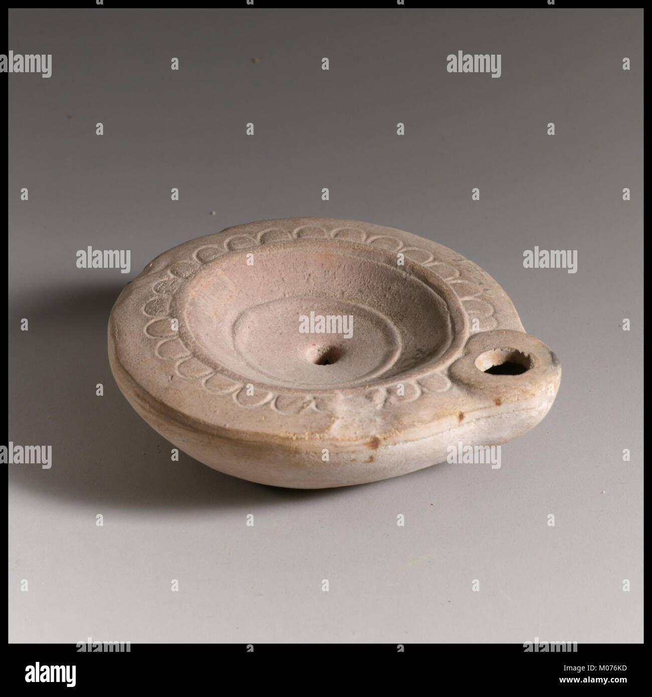 This lamp is an example of ancient lighting technology, showcasing a ...