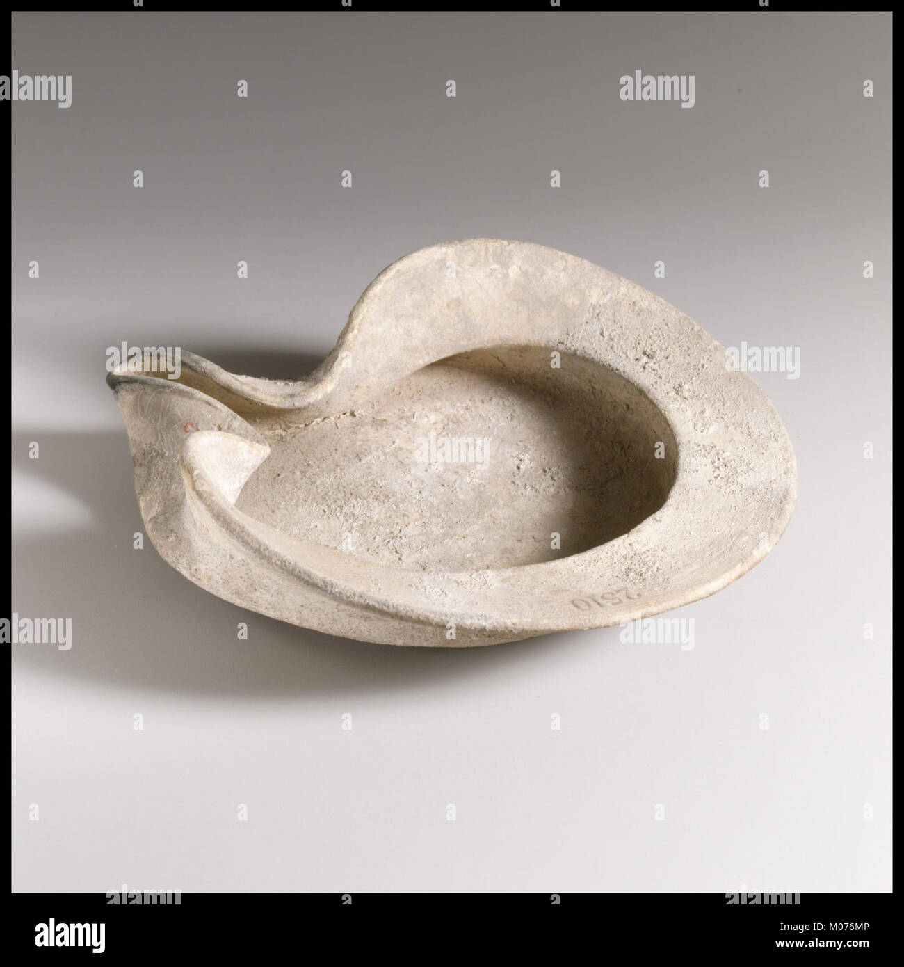 A saucer-shaped lamp from the MET collection, showcasing ancient ...