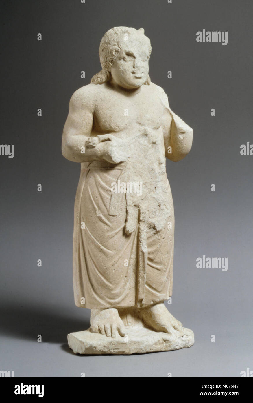 Limestone statue depicting a god, housed in The Metropolitan Museum of ...
