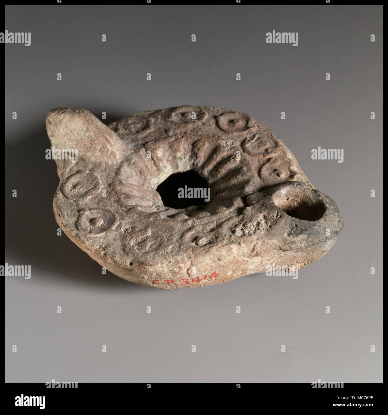 This lamp is an example of ancient lighting, showcasing intricate ...
