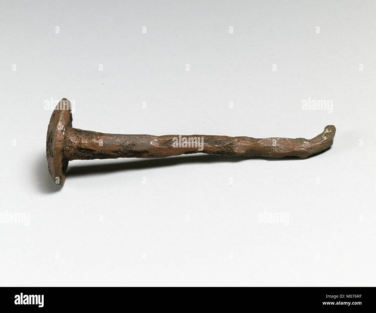 This nail is an ancient artifact that showcases the craftsmanship and ...